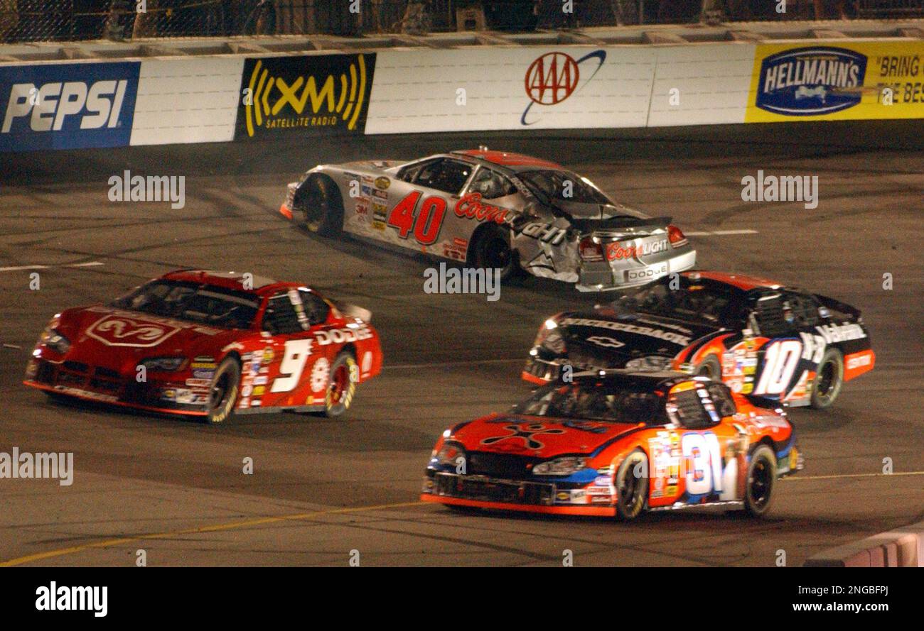 Sterling Marlin (40) spins in turn 2 as Kasey Kahne (9), Jeff Burton ...