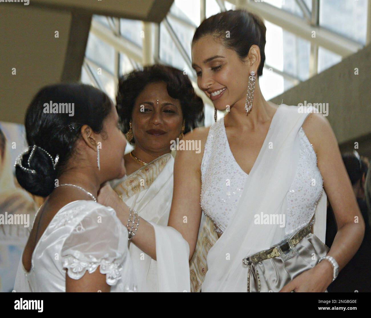 "Water" actress Lisa Ray (right) shares a moment with actress Sarala ...
