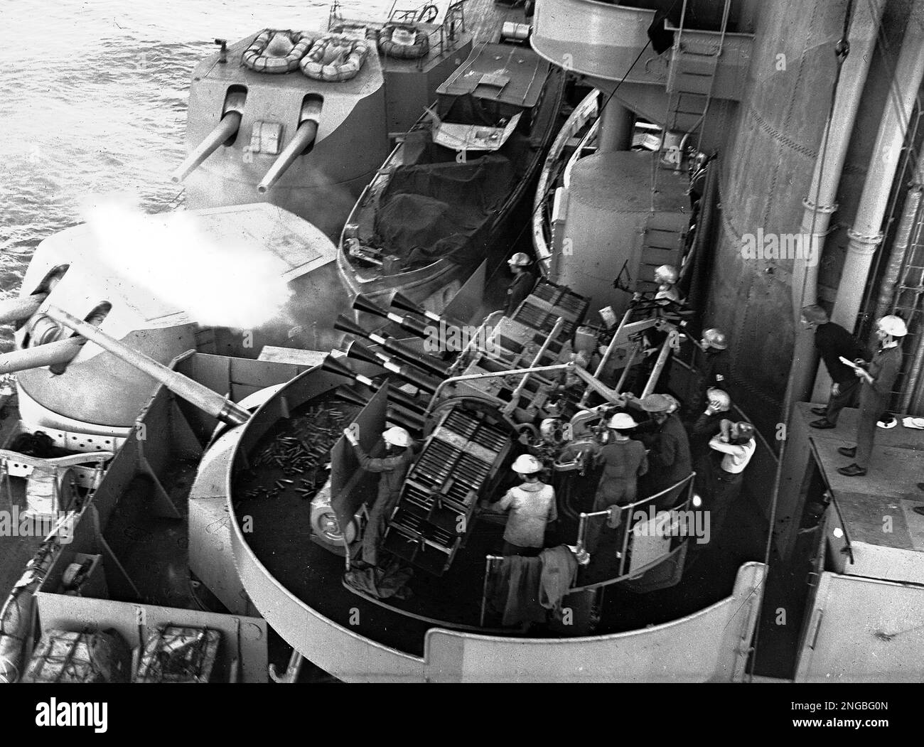 The crew of Britain's HMS Rodney, a Nelson-class battleship of the ...