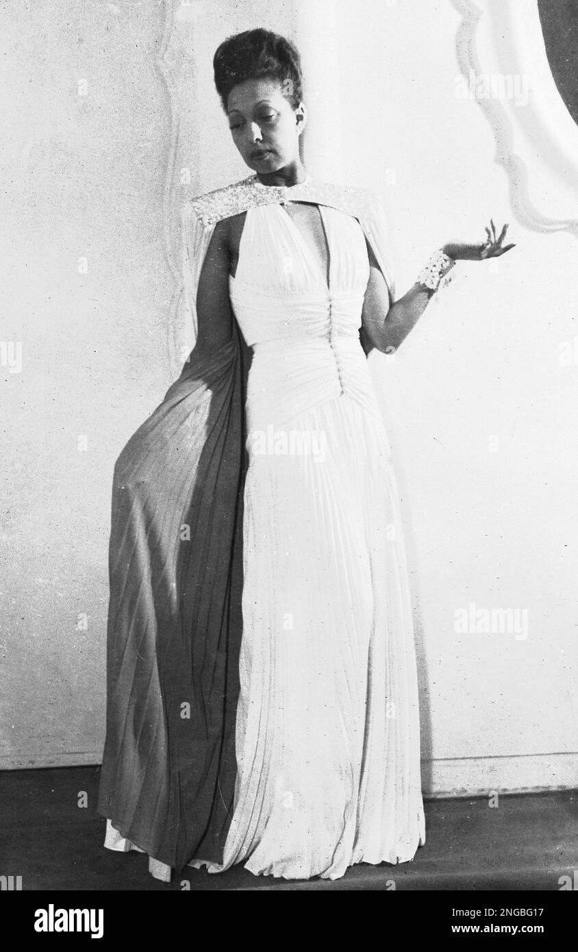 French cabaret star Josephine Baker models a glamorous dress during a ...