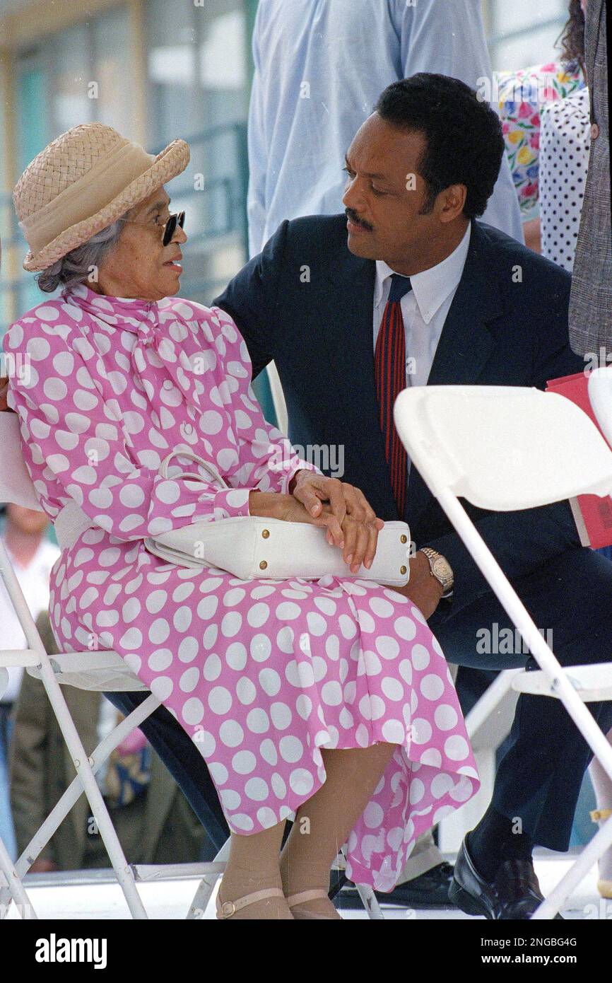 The Rev. Jesse Jackson talks with Rosa Parks at the dedication of the ...