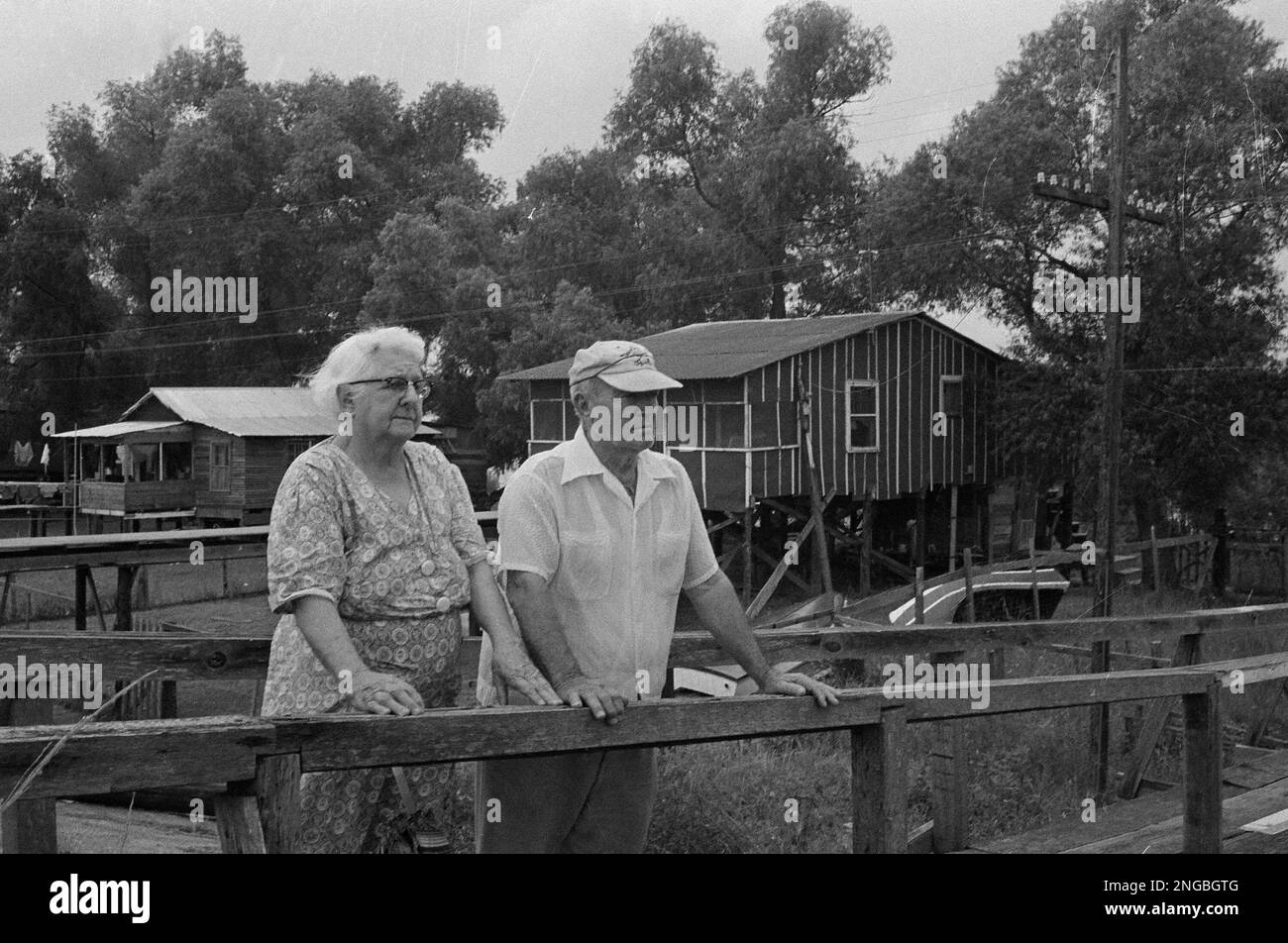 New Orleans batture homeowners Mr. and Mrs. William Carlin look out ...