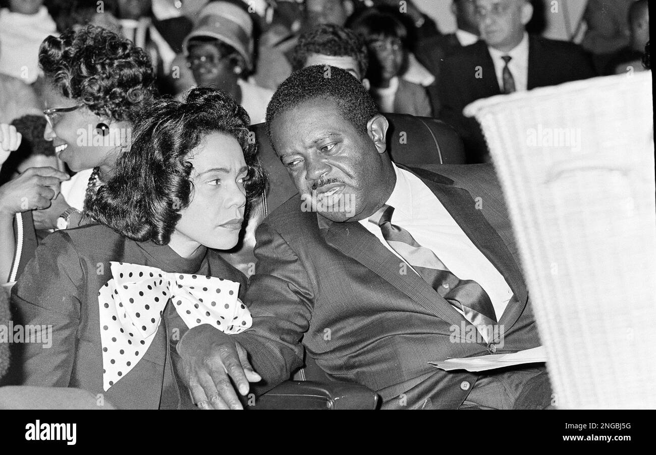 The Rev. Ralph Abernathy leans over to talk with Coretta Scott King ...