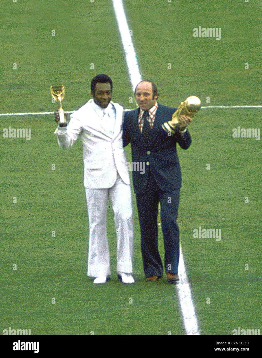 Brazilian soccer legend Pele holds the Jules Rimet Cup as West Germany ...