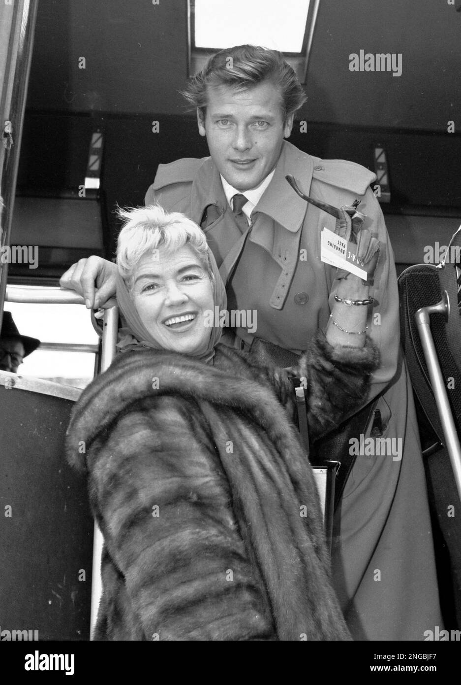 British actor Roger Moore and his wife, singer Dorothy Squires, leave ...