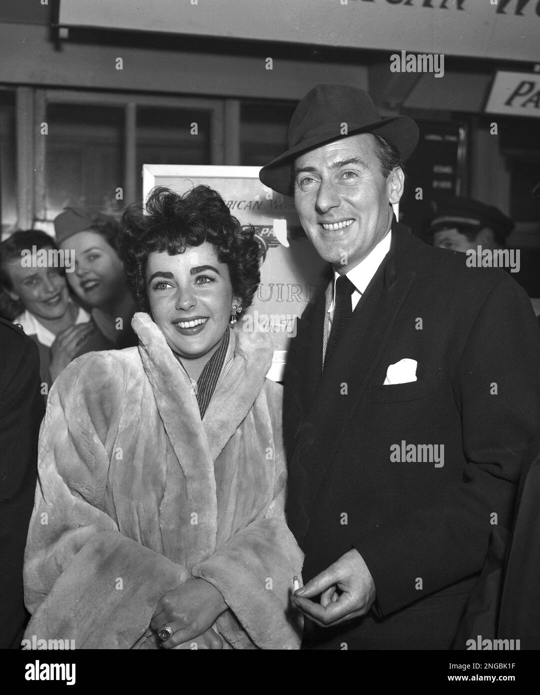 Actress Elizabeth Taylor is greeted by fiance Michael Wilding on her ...