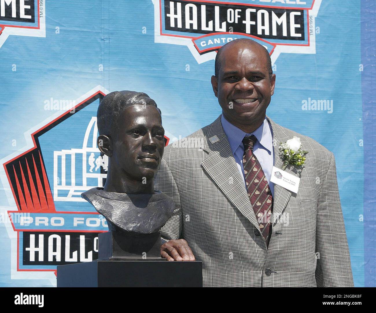 Steven Towns stands next to the bust of Fritz Pollard, former pro ...