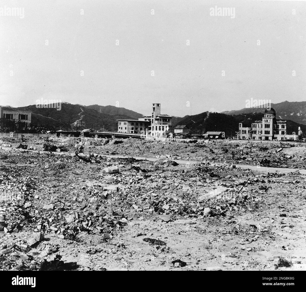 A few gutted buildings rise from the rubble of Hiroshima, Japan, a year ...