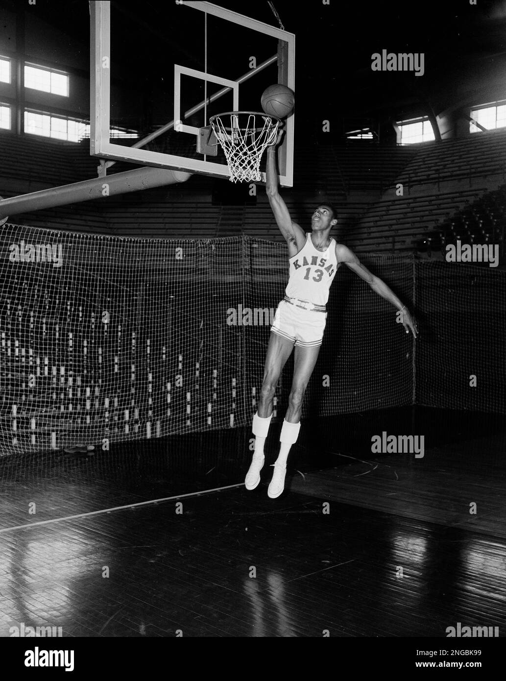 Wilt Chamberlain (13), University of Kansas center, is shown in 1957 ...