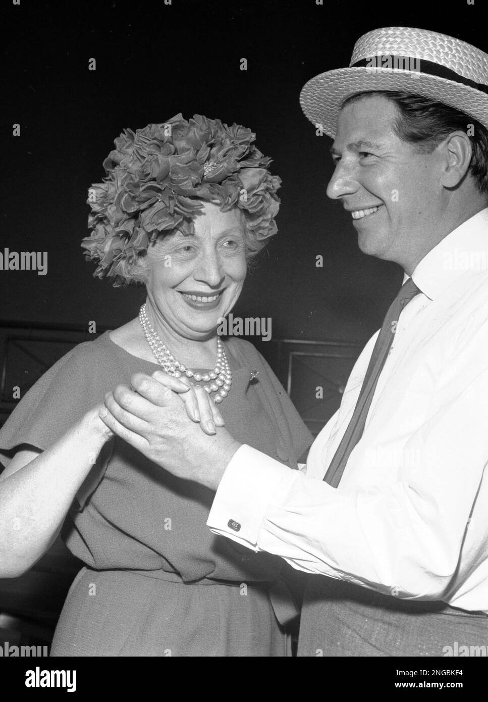 British comedian and singer Max Bygraves, dances with actress Dame ...