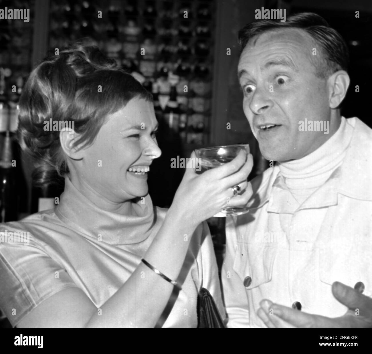 British actress Judi Dench toasts fellow actor Alec McCowan during a ...