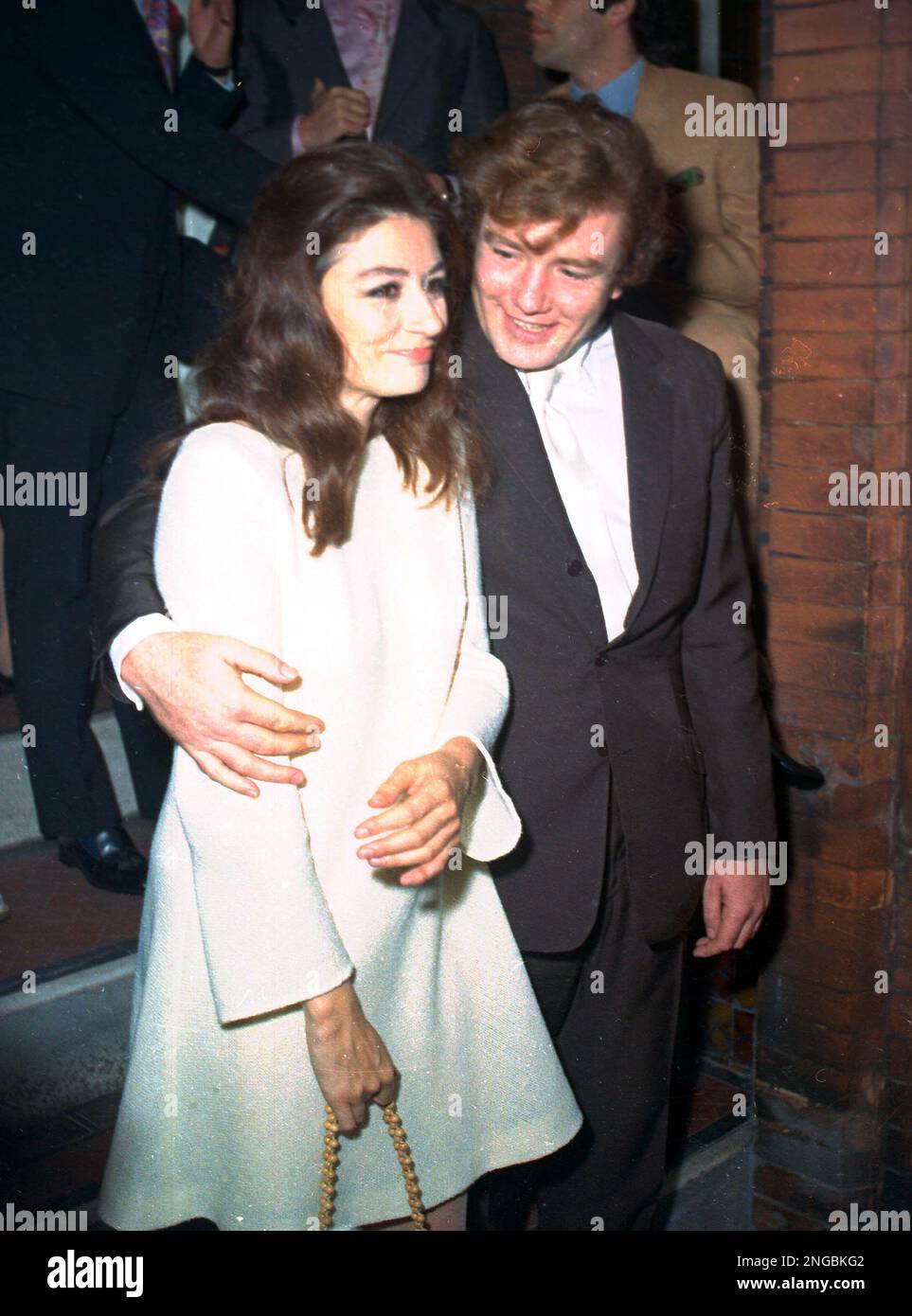 British actor Albert Finney embraces his bride French actress Anouk ...