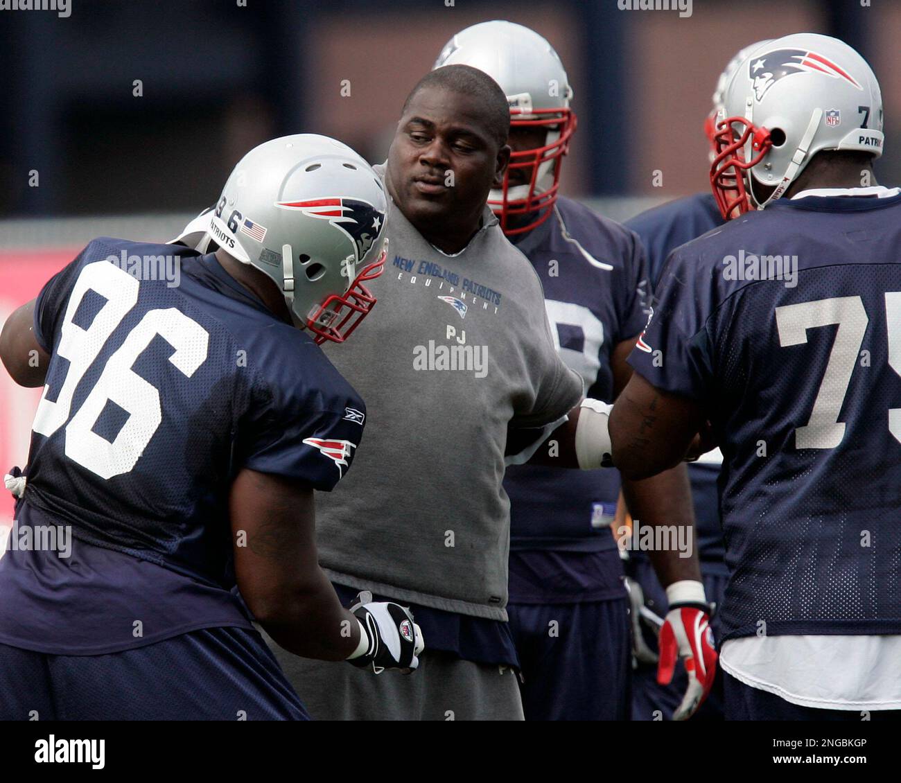 New England Patriots defensive line coach Pepper Johnson, center, works ... New England Patriots defensive line coach Pepper Johnson, center, works ...
