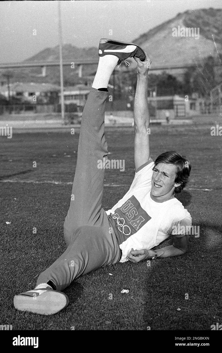 High jumper Dwight Stones does some stretching exercises at Glendale ...