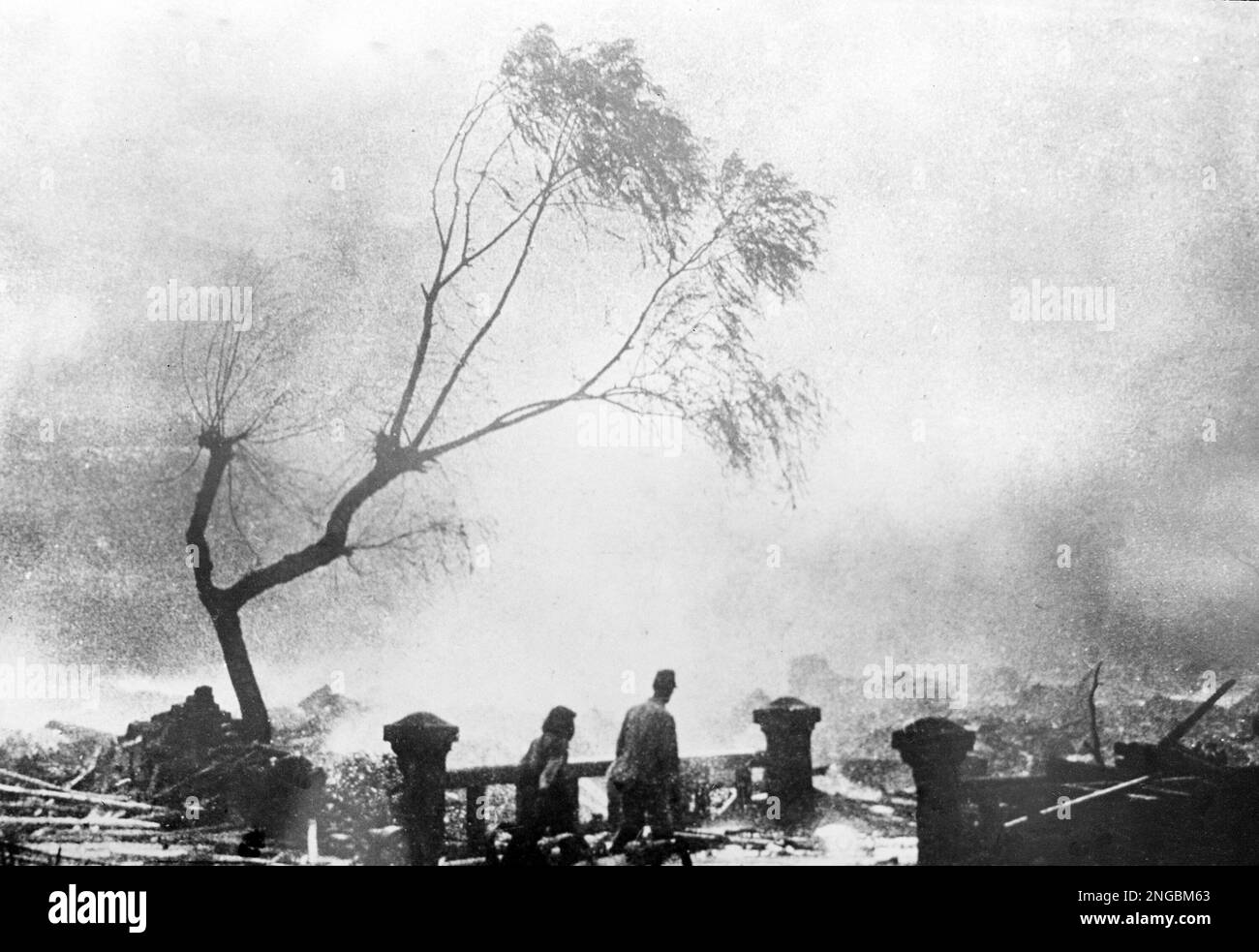 Survivors of the atomic bomb attack of Nagasaki walk through the ...