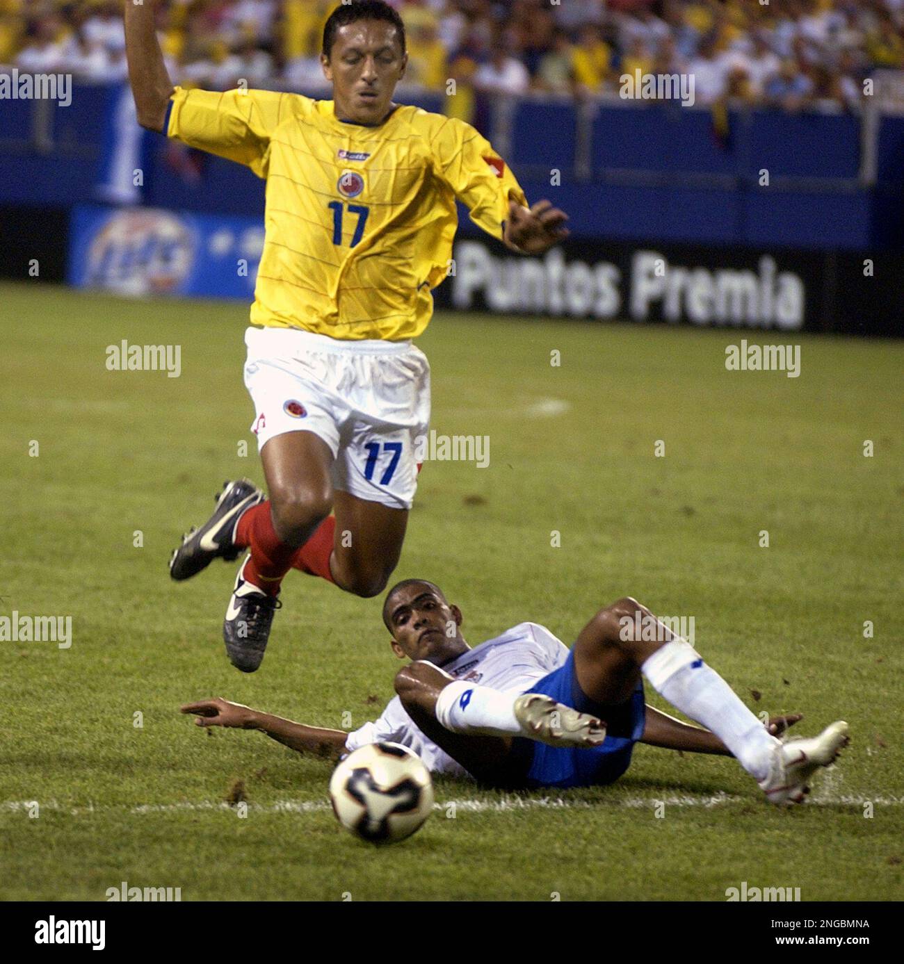 Colombia's Jairo Patino (17) avoids the challenge from Panama's Gabriel ...