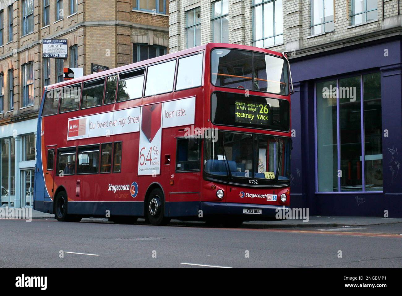 A London Bus number 26 stands abandoned on Hackney Road in East London ...