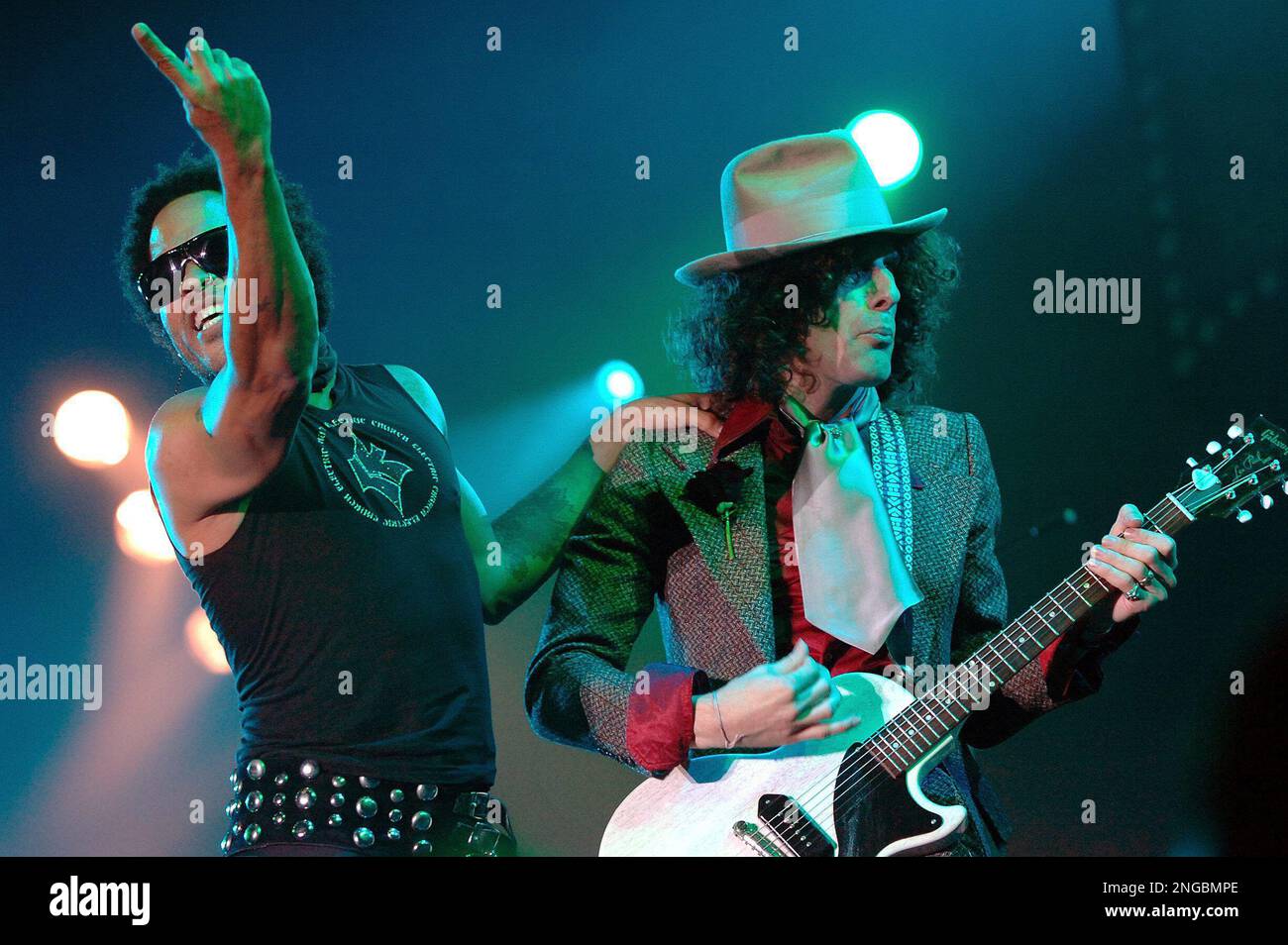 U.S. singer Lenny Kravitz, left, performs with his guitarist Craig Ross ...
