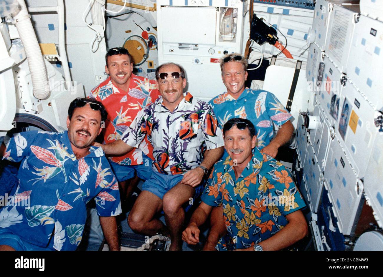 In this image provided by NASA, the space shuttle Discovery crew show ...