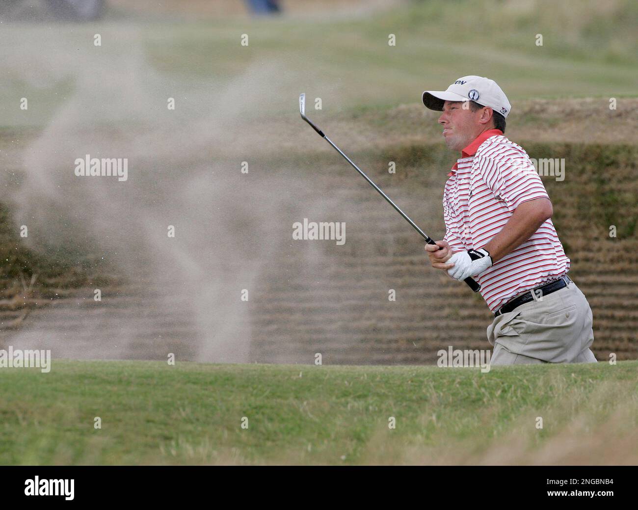 Bob Tway of the United States gets a face full of sand as he plays out ...