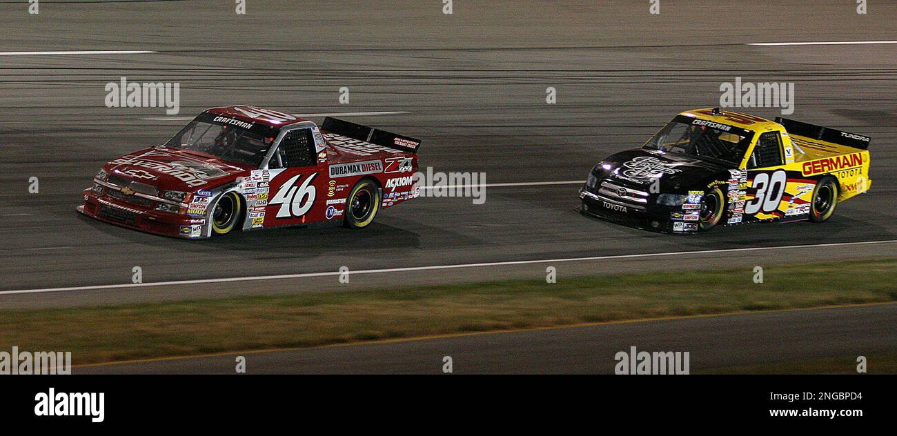 Dennis Setzer, left, holds off Todd Boidine through the second turn on ...