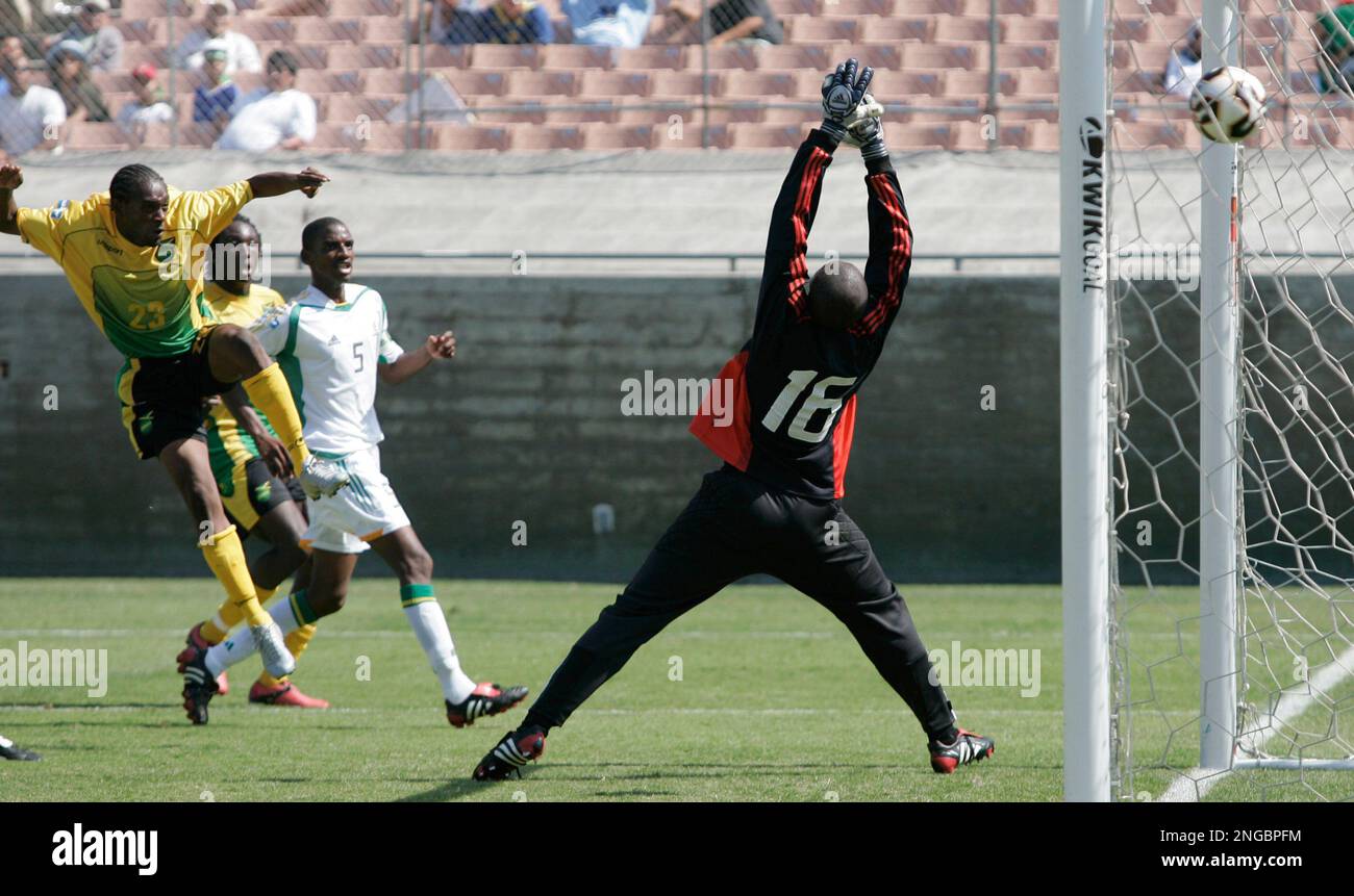 Jamaica's Teafore Bennett, left, scores on South Africa's Thabani ...