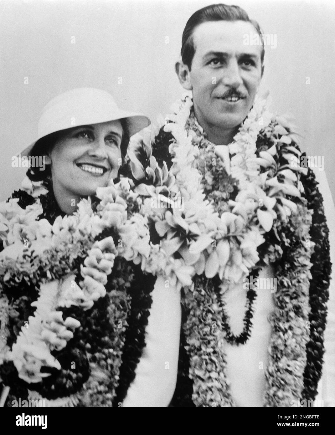 Walt Disney and his wife Lillian arrive in Honolulu for a week's stay ...
