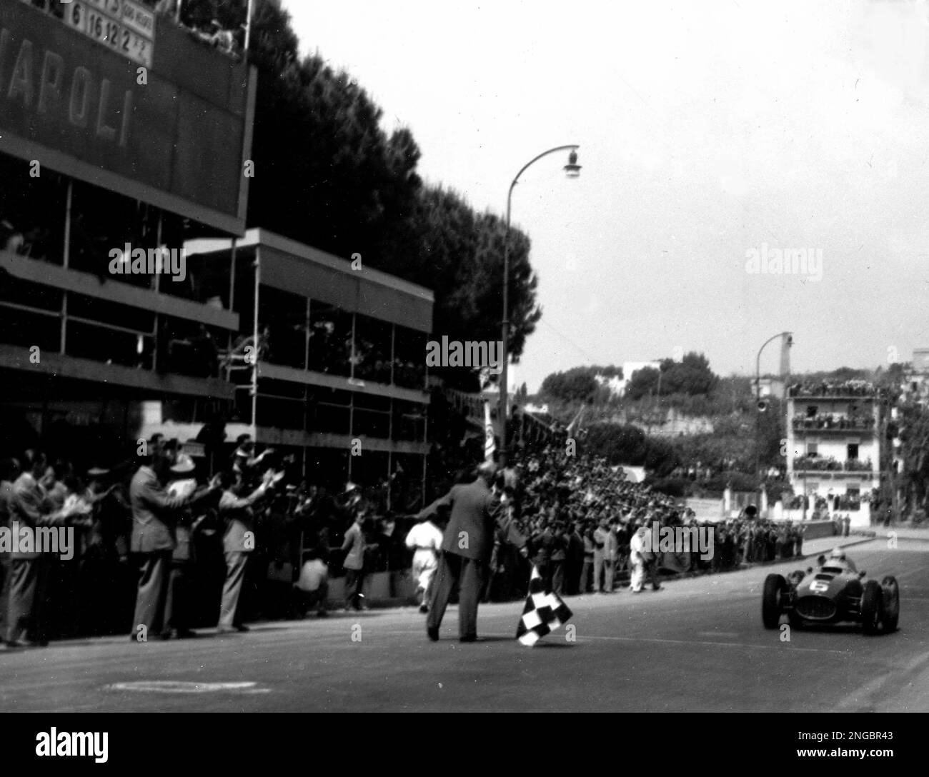 Italy's Alberto Ascari crosses the finishing line after winning the ...