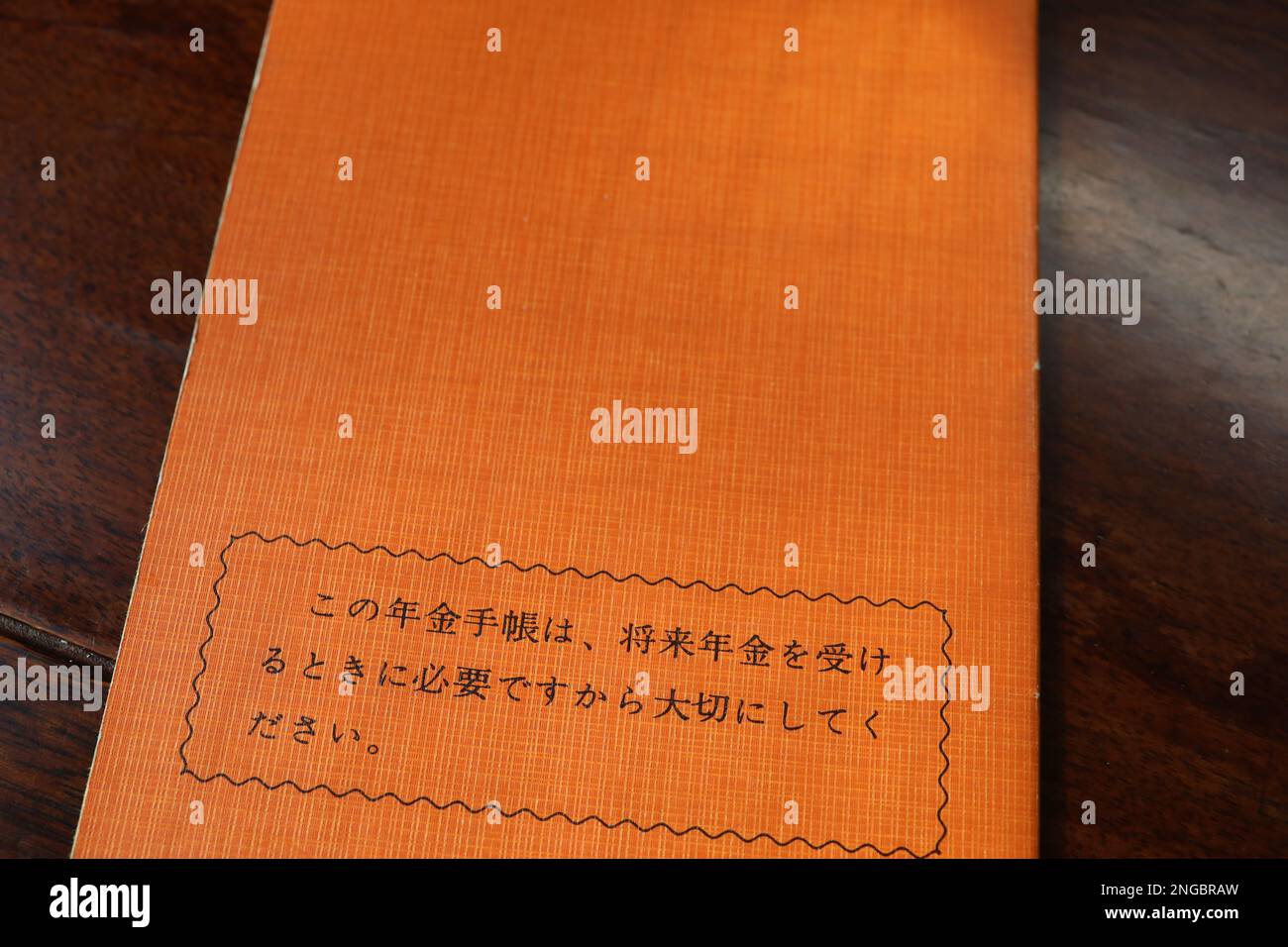 February 2023, Tokyo, Japan.Japanese pension book and cash on the table ...