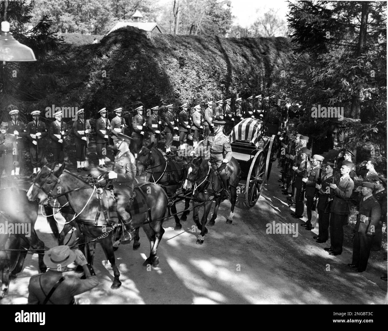 An armed guard of honor lines the route as the body of President ...