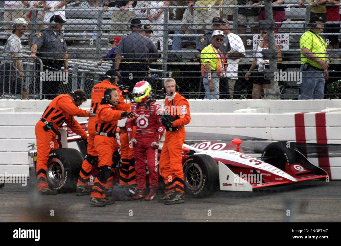 Rescue personnel direct Ryan Briscoe to the infield care center after ...