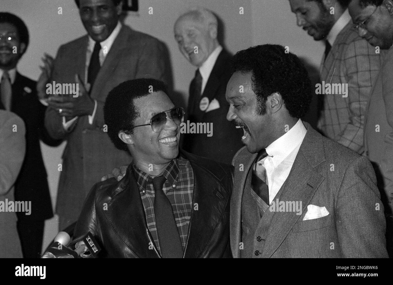 The Rev. Jesse Jackson, right, chats with tennis star Arthur Ashe at a ...