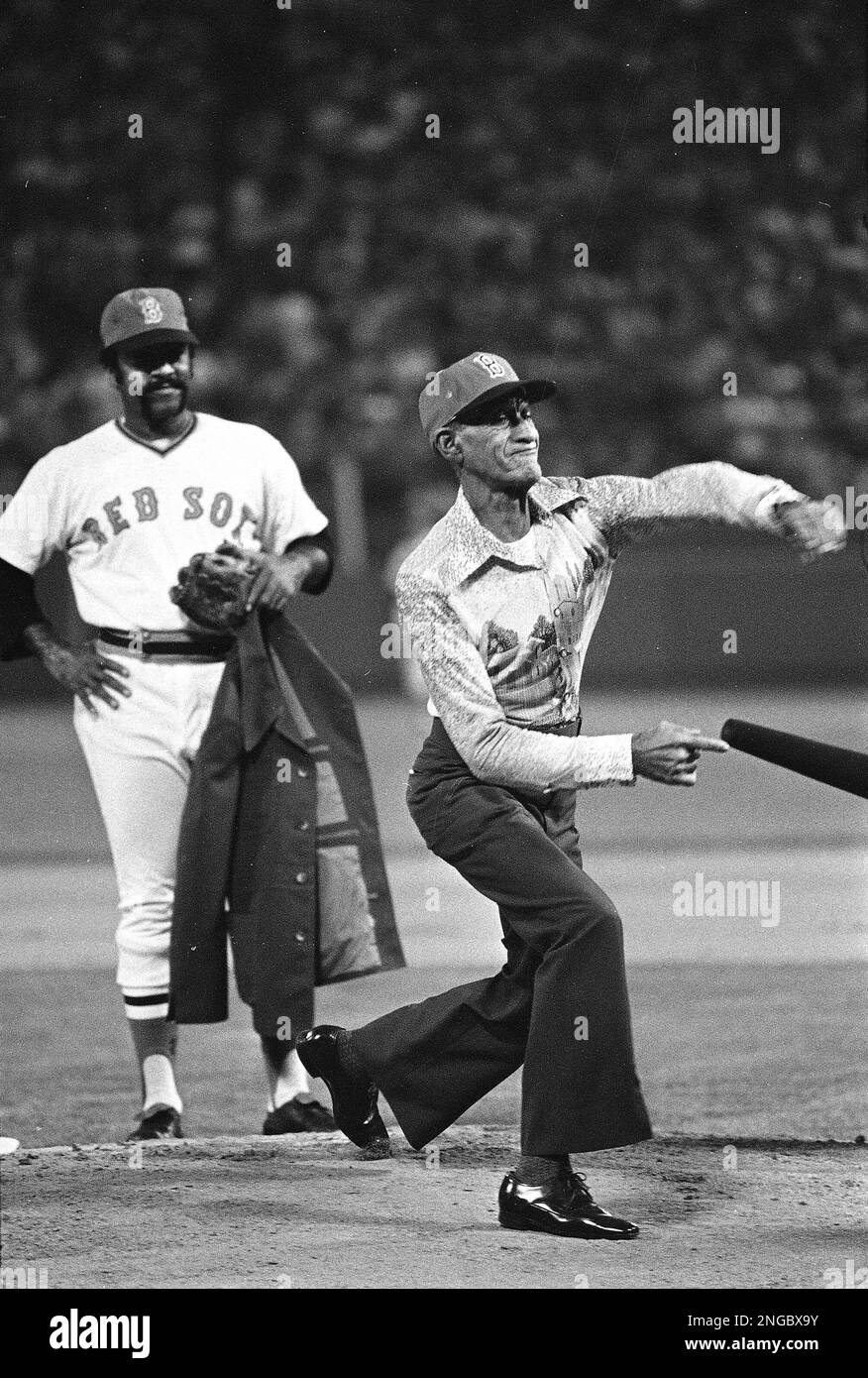Red Sox pitcher Luis Tiant stands by the pitching mound as his father ...