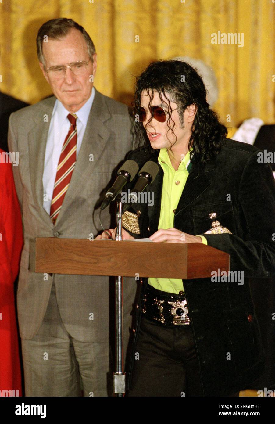 President Bush looks on as entertainer Michael Jackson, a Points of ...
