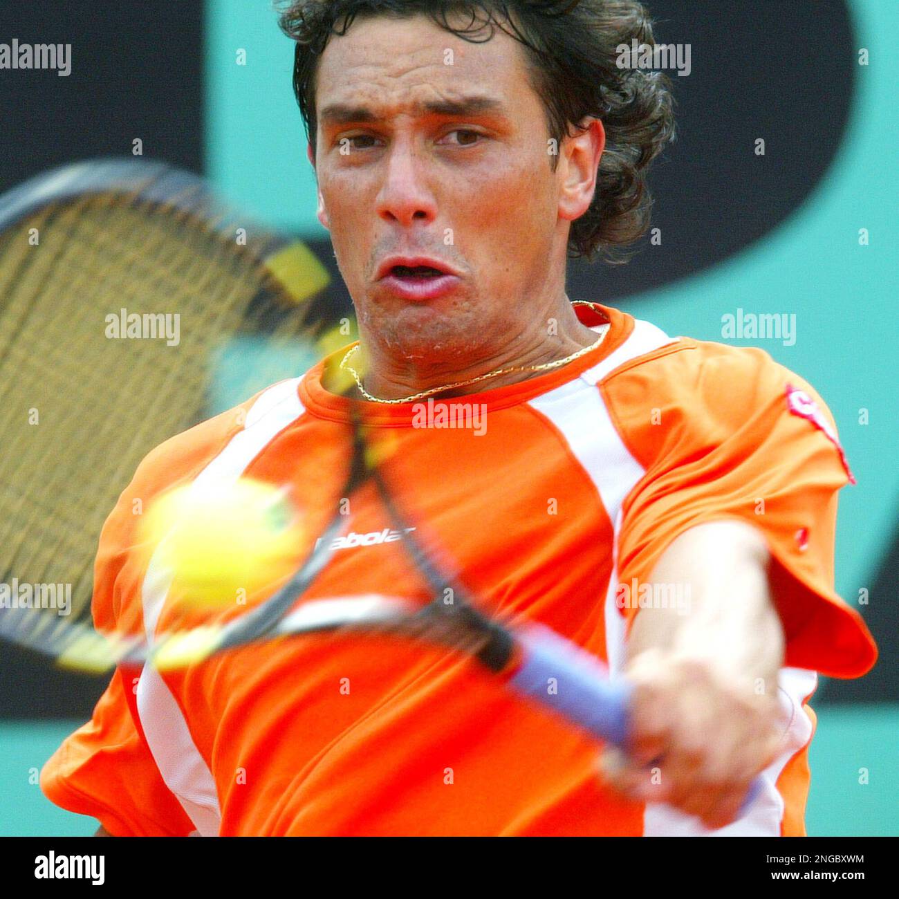 Argentina's Mariano Puerta backhands to Spain's Rafael Nadal during the ...