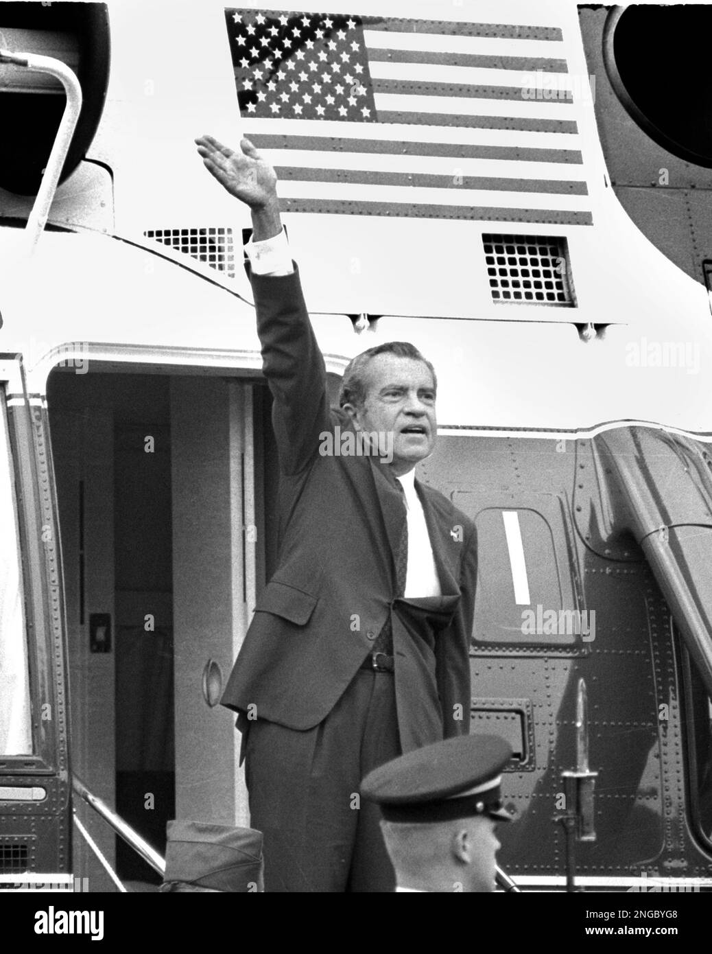 Richard M. Nixon waves a final farewell from the helicopter steps as he ...