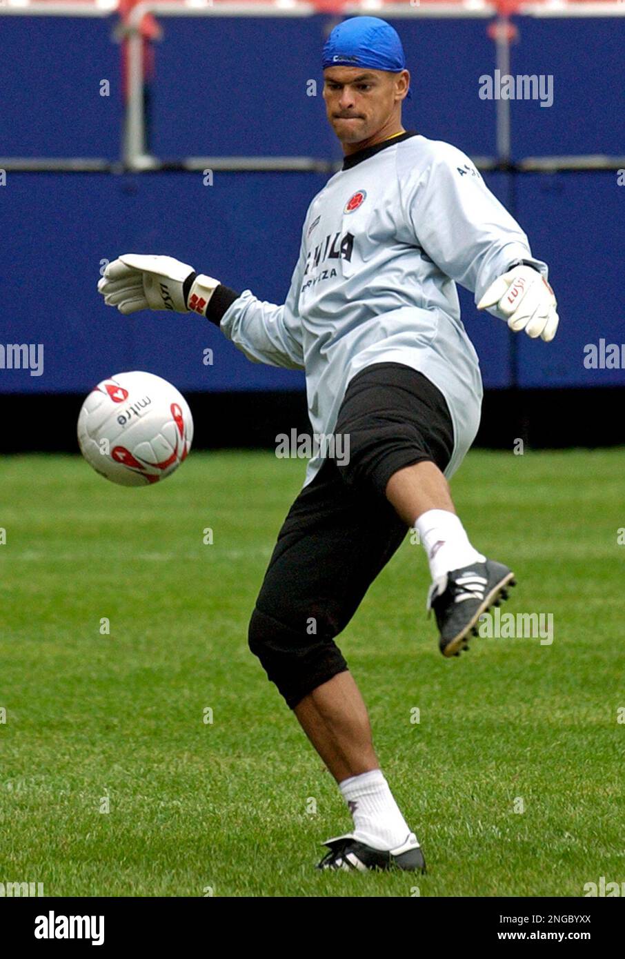 Colombia goalkeeper Miguel Calero kicks a ball during practice Monday ...