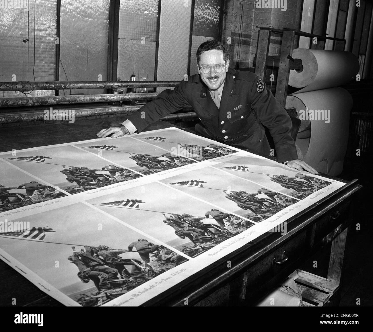 Joe Rosenthal, AP war photographer, sits with copies of his famous Iwo ...