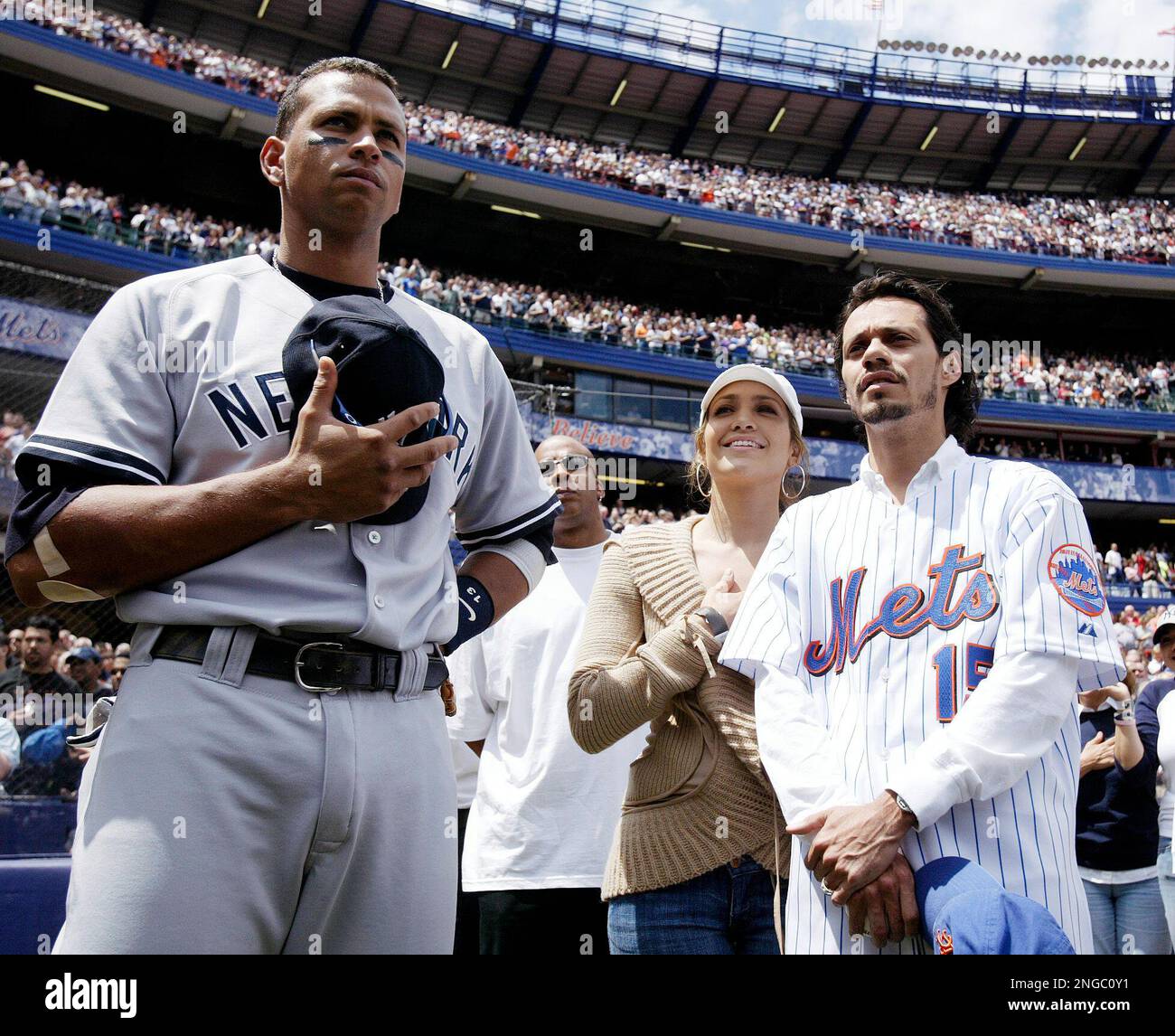 New York Yankees third baseman Alex Rodriquez, left, stands with ...