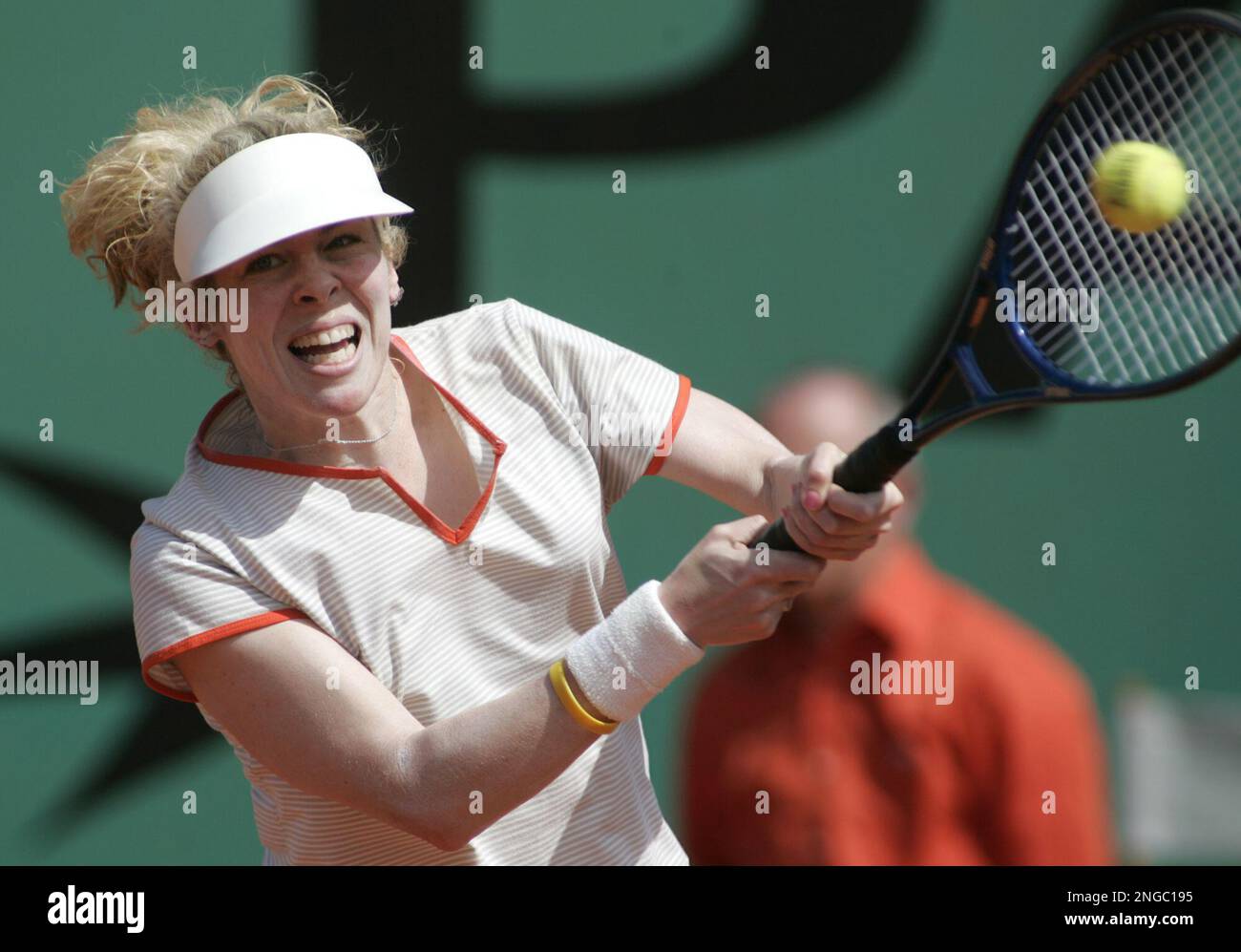 Amy Frazier of the U.S. returns the ball to France's Emilie Loit during ...