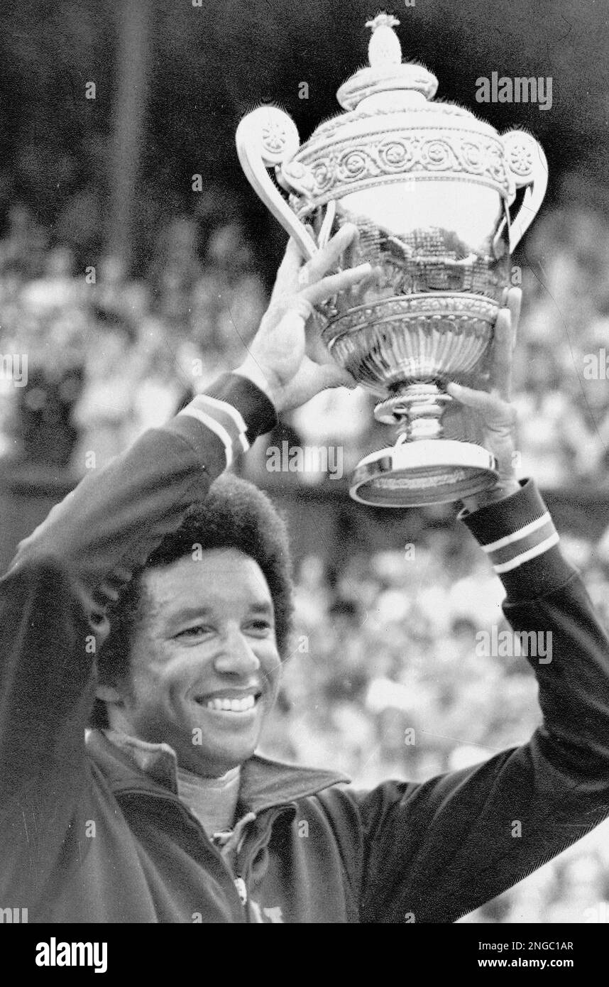 Arthur Ashe of Richmond, Va., the new men's singles champion, holds the ...
