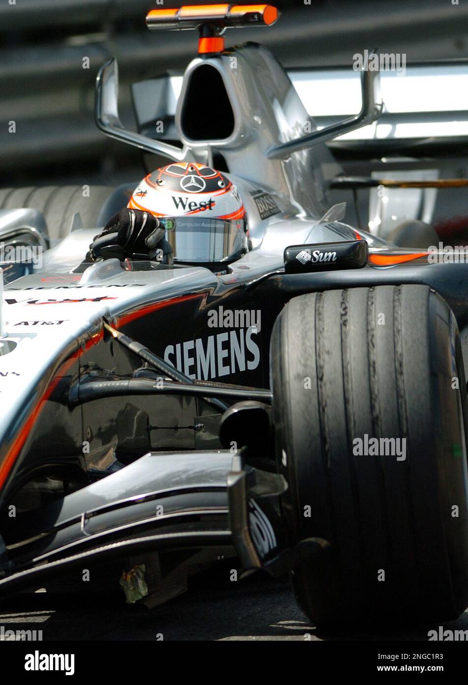 Kimi Raikkonen of Finland steers his Mc Laren Mercedes on his way to ...