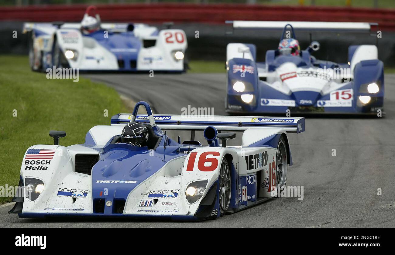 Butch Leitzinger (16) leads a pack of cars through turn 12 on his way ...