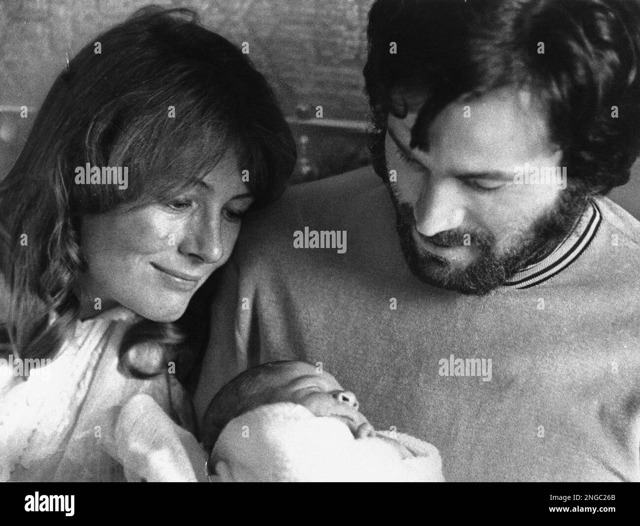 Actors Vanessa Redgrave and Franco Nero look lovingly at their newborn ...