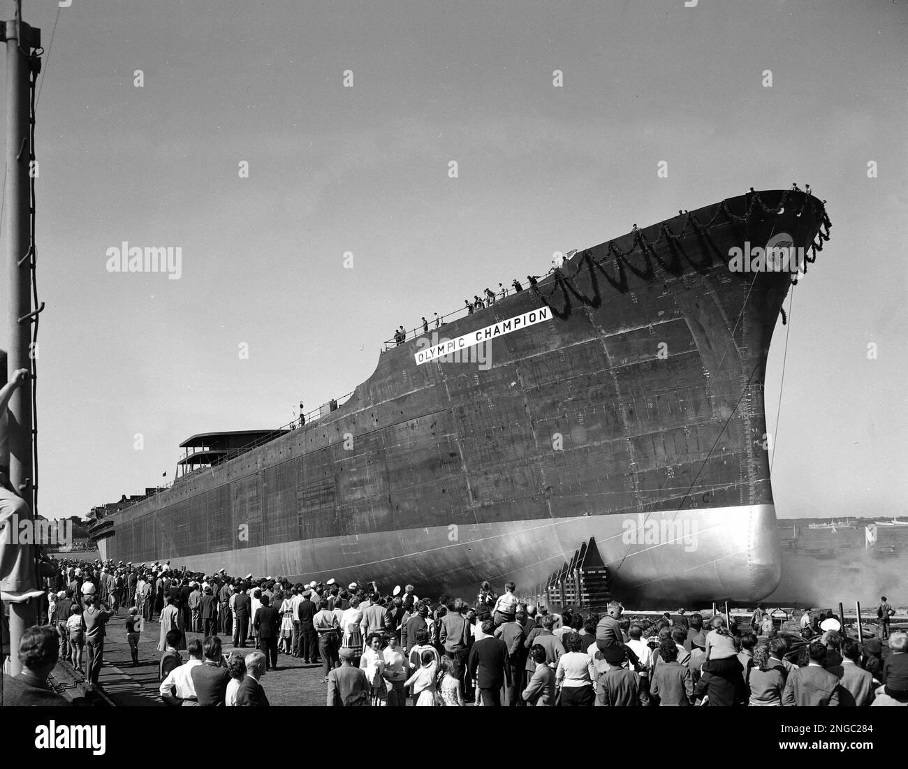 Thousands of onlookers crowd the Howaldt Shipyards at Kiel, Germany ...