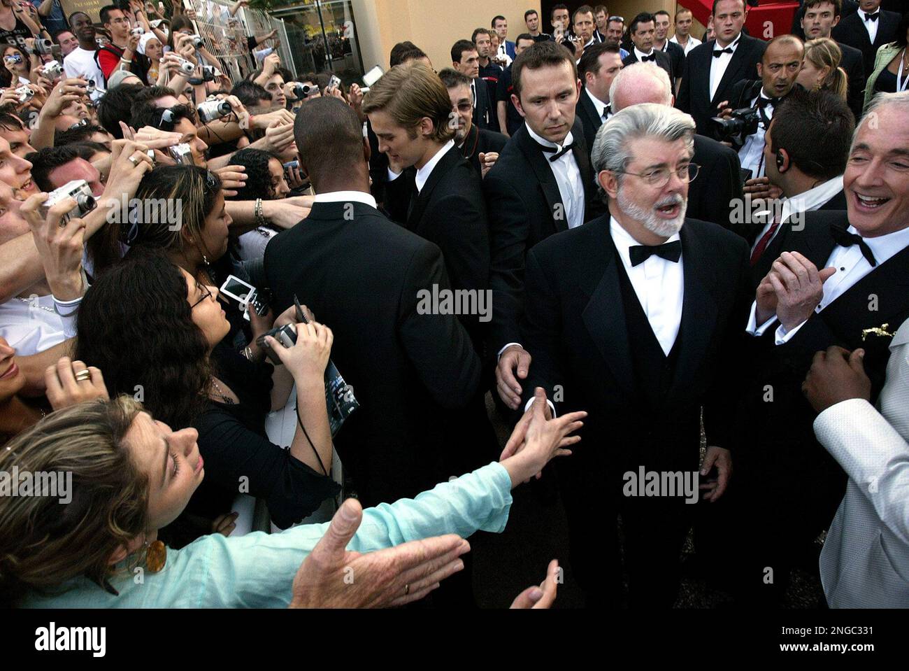 American director George Lucas, foreground left, greets fans as he ...