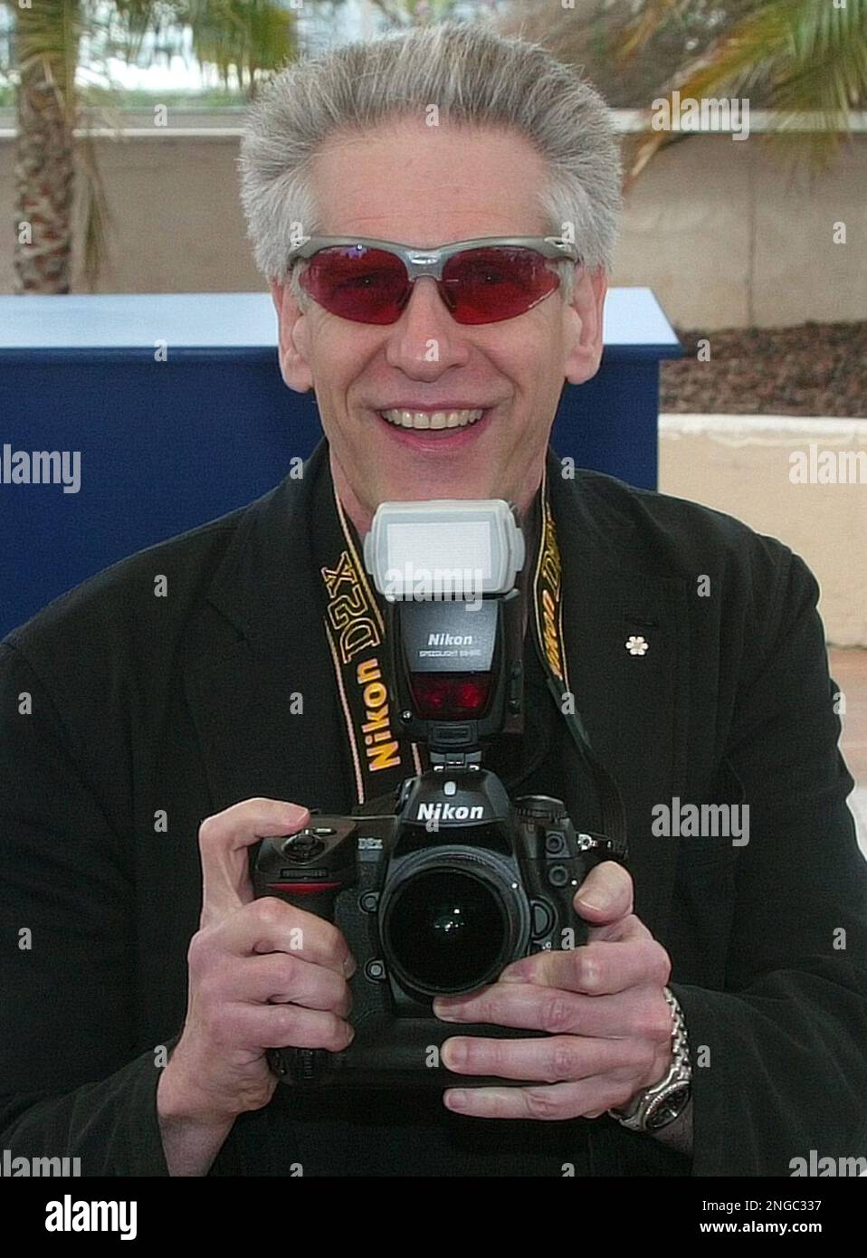 Canadian director David Cronenberg takes photos of photographers during ...