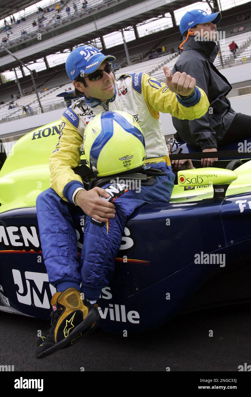 Indy Racing League driver Vitor Meira of Brazil acknowledges the fans ...