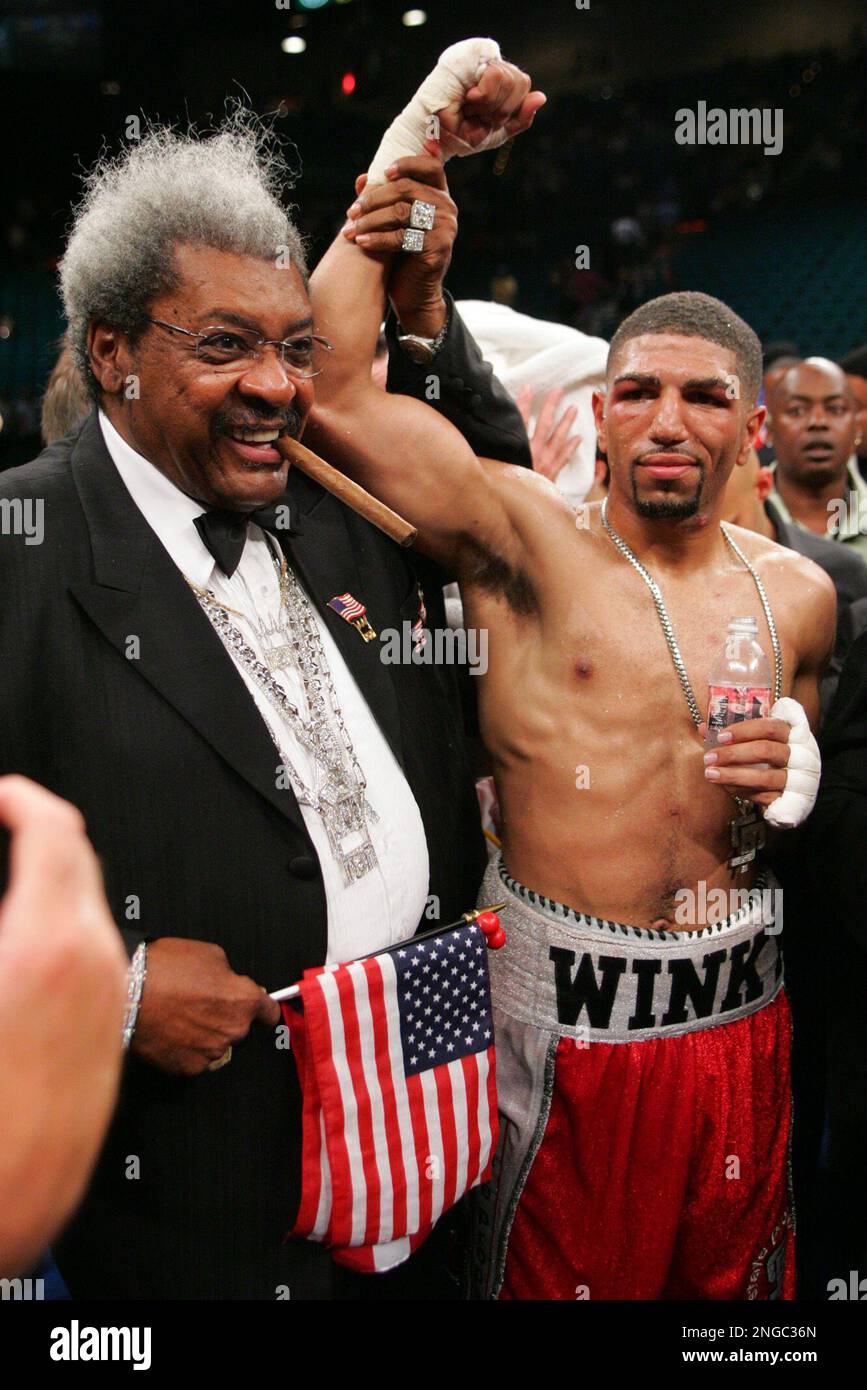 Boxing promoter Don King, left, holds up the arm of Winky Wright, of St ...