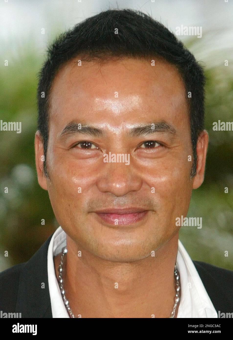 Chinese actor Simon Yam poses for photographers during a photo call for ...